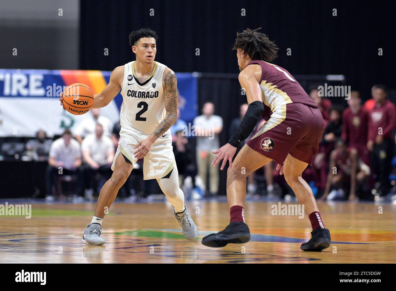 Colorado guard KJ Simpson (2) is defended by Florida State guard Jalen ...