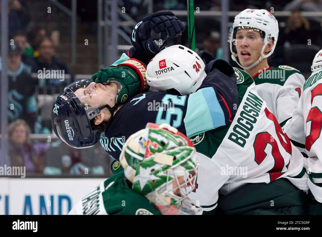 Seattle Kraken left wing Tye Kartye (52) and Minnesota Wild defenseman ...