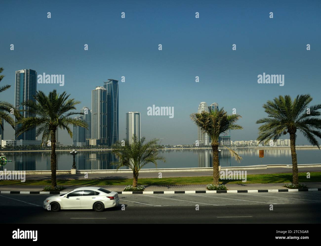 The channgin skyline along the Corniche in Sharjah, UAE Stock Photo - Alamy