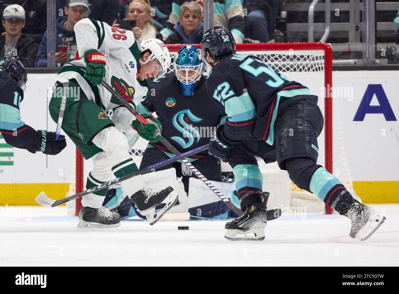 Minnesota Wild center Connor Dewar (26) skates with the puck in front ...
