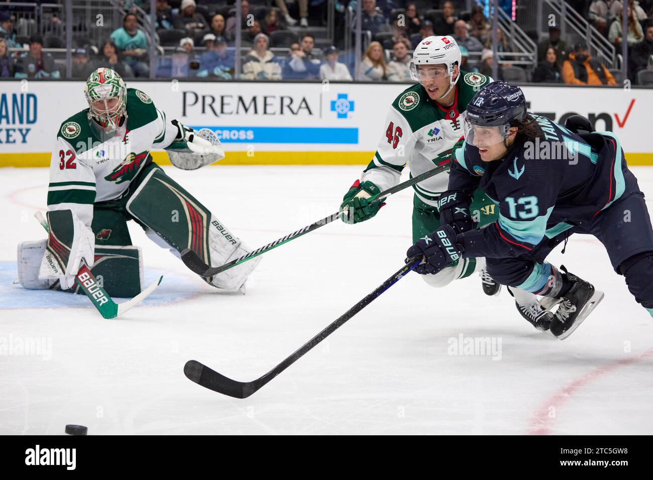 Seattle Kraken left wing Brandon Tanev (13) and Minnesota Wild ...