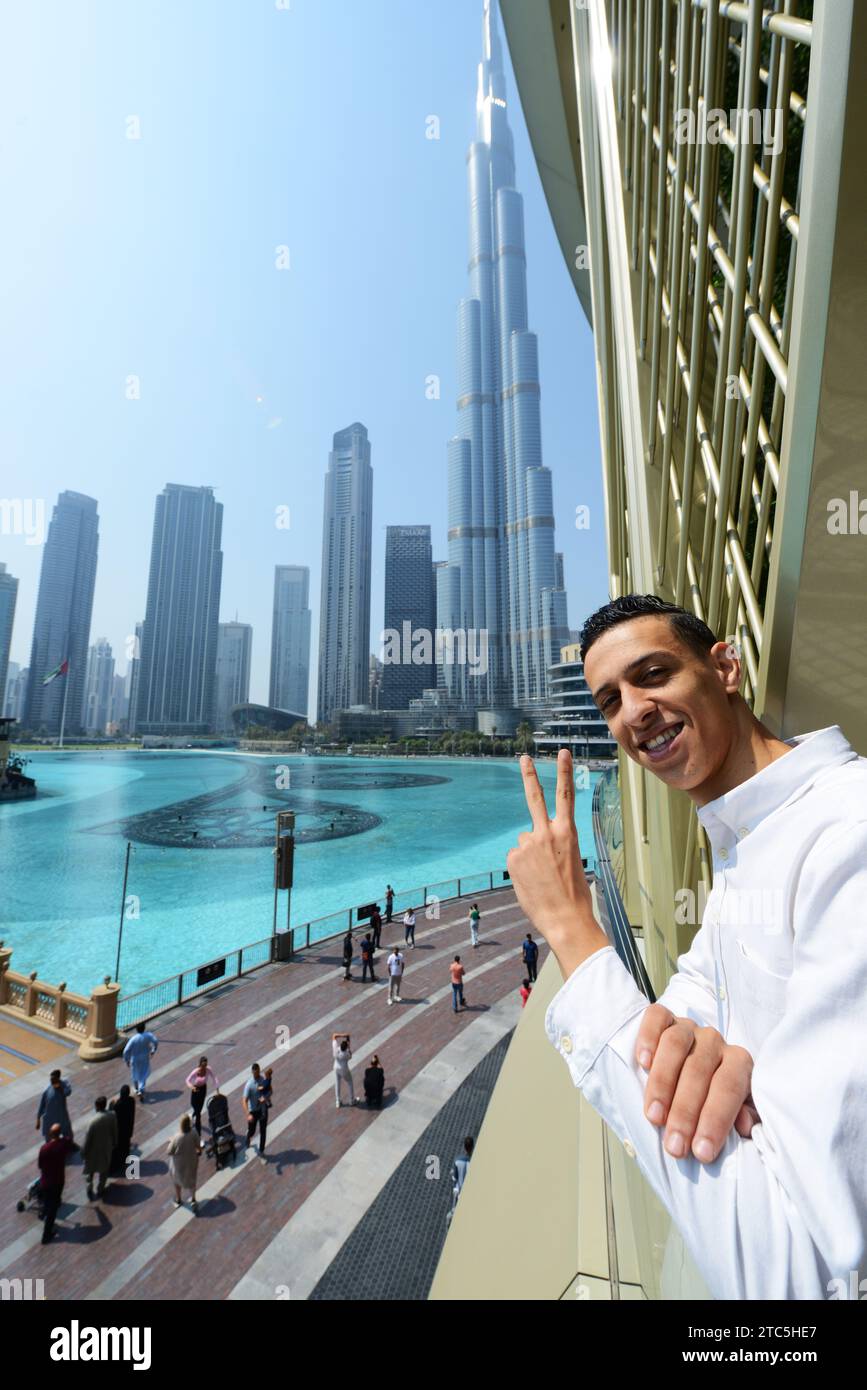 A Moroccan tourist with the Burj Khalifa tower in the background. Dubai ...