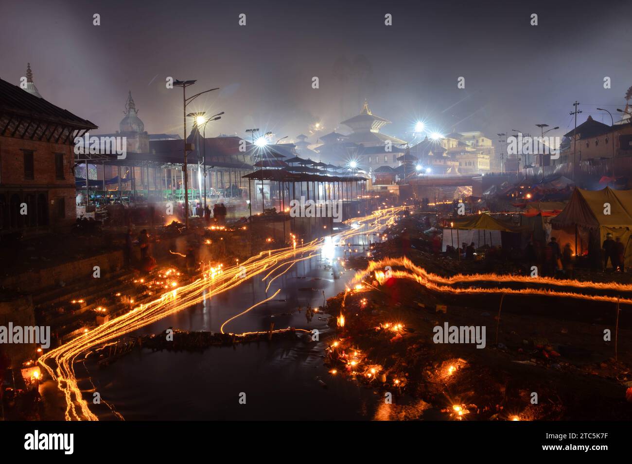 Kathmandu, Nepal. 11th Dec, 2023. The oil lamps float in the Bagmati ...