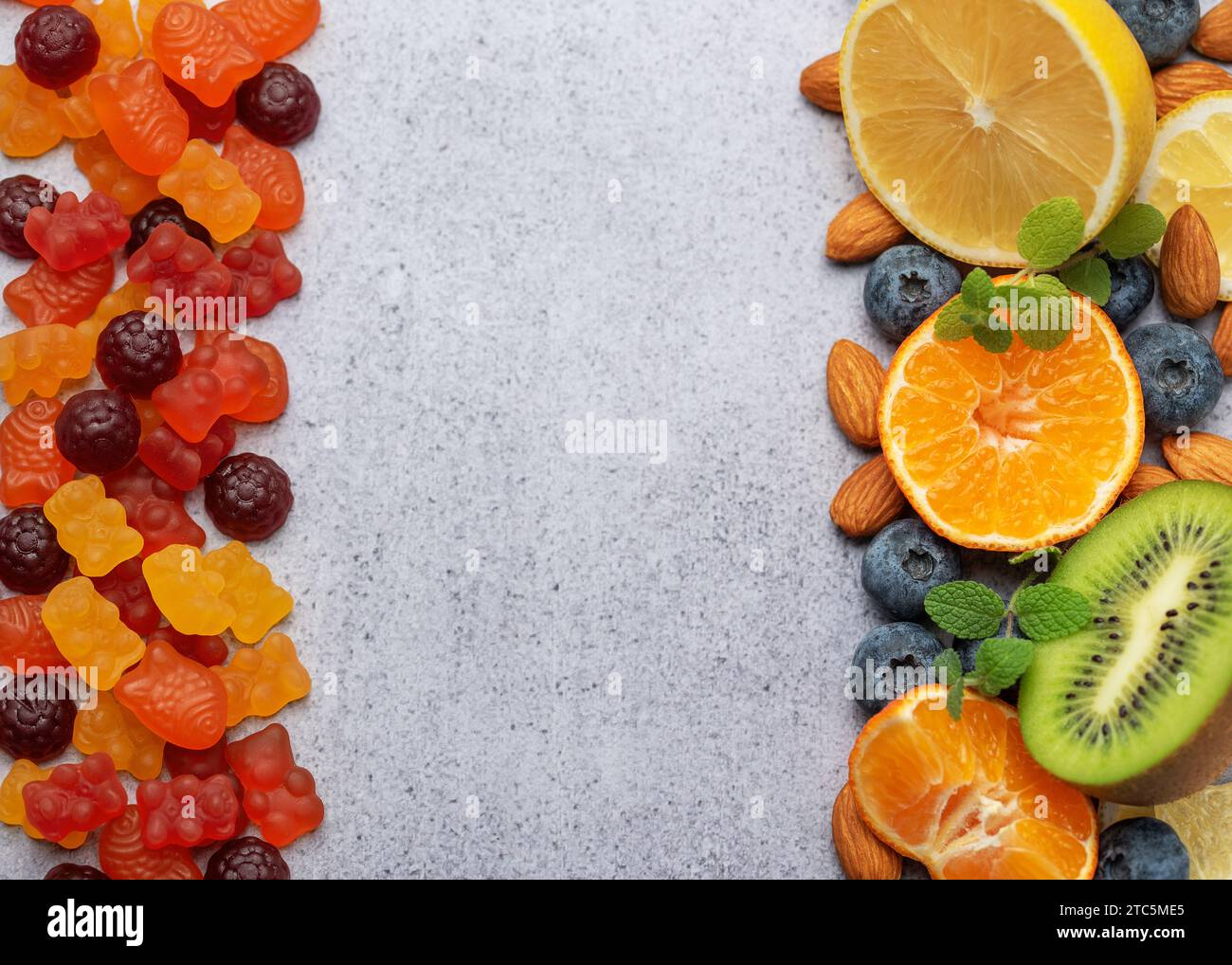 Chewable gummy bears vitamins and supplements and fresh fruits Stock ...