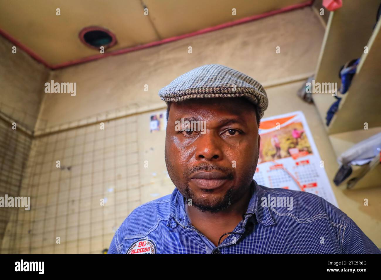 George Otieno a shoe maker from Kibera makes shoes using fabrics from ...