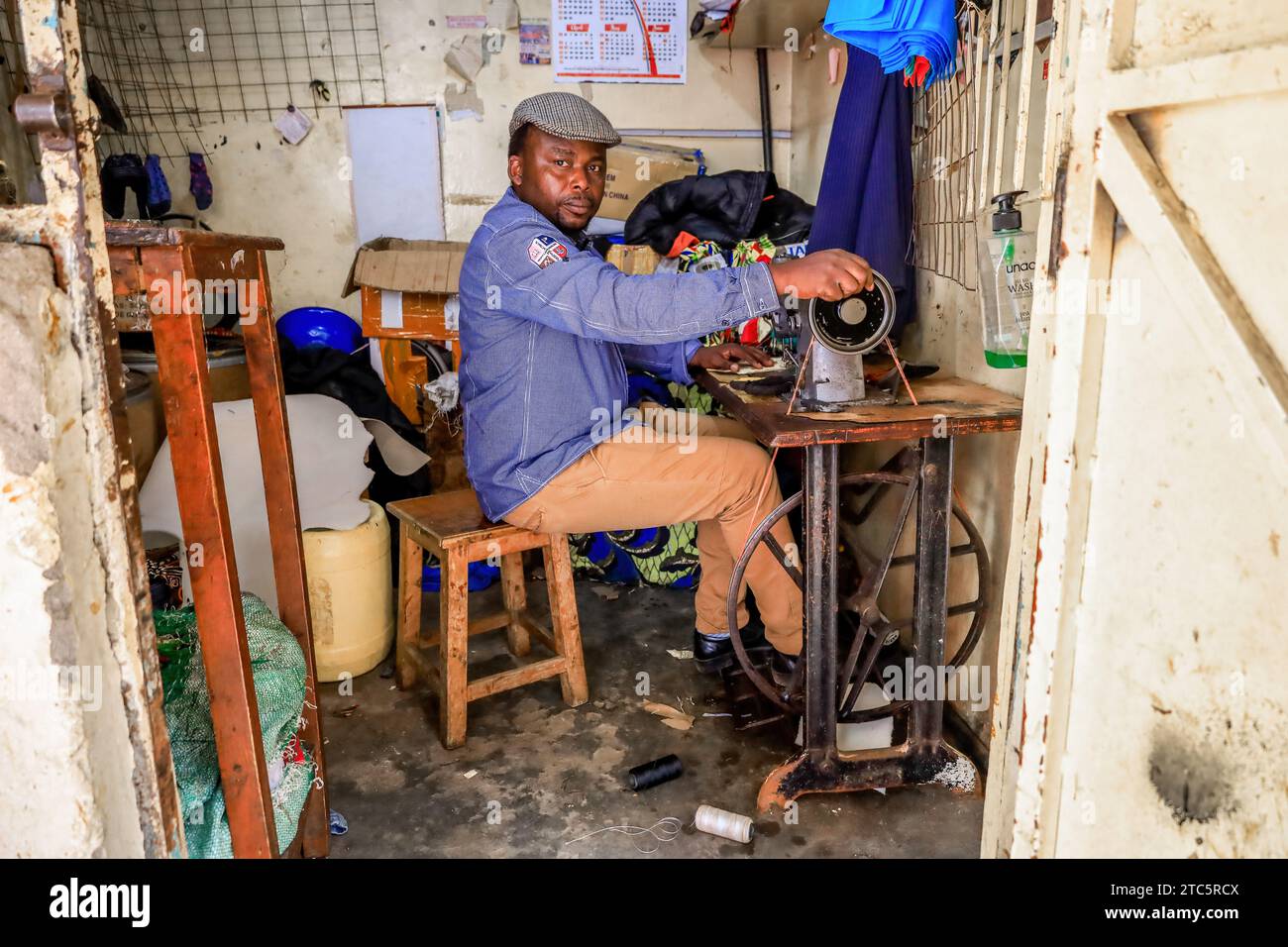 George Otieno a shoe maker from Kibera makes shoes using fabrics from ...