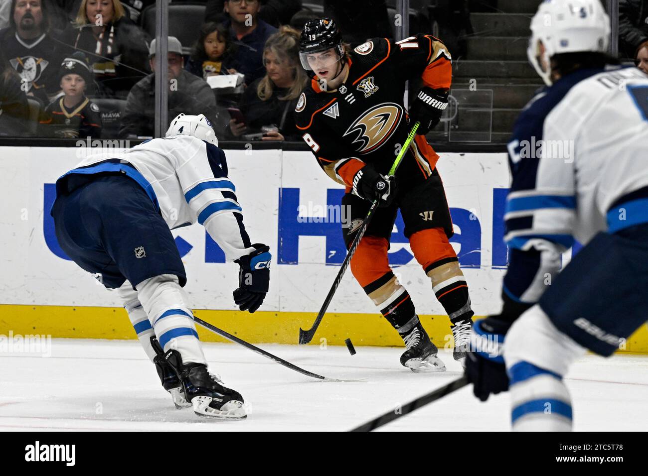 Anaheim Ducks right wing Troy Terry, center, passes the puck past ...