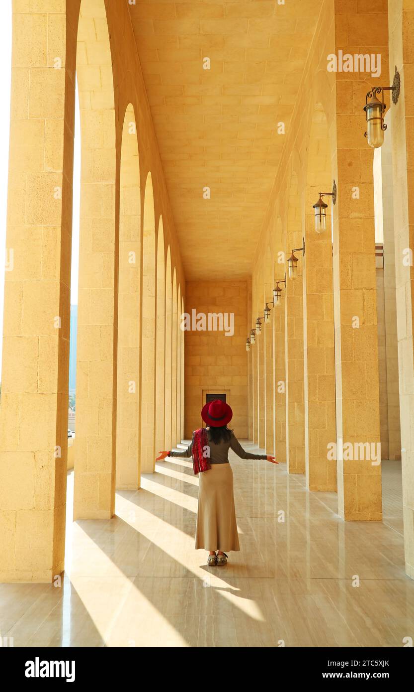 Female visitor being impressed by the mosque's marble corridor Stock ...
