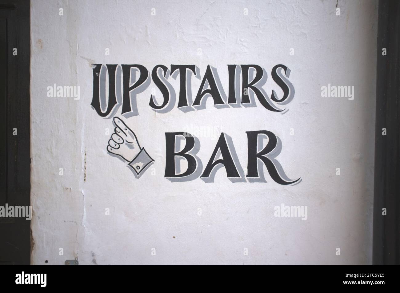 Upstairs bar painted sign Stock Photo - Alamy
