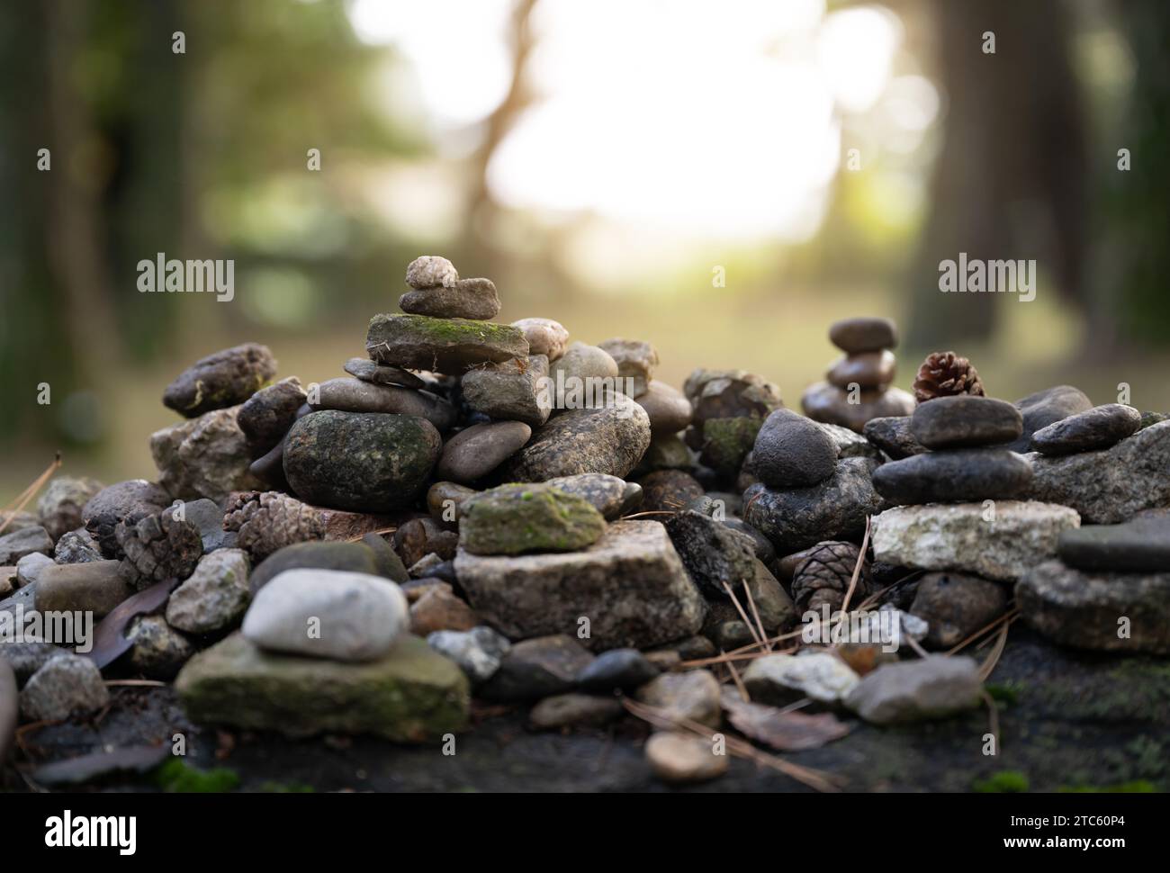 building a stone tower with one's hands Stock Photo - Alamy