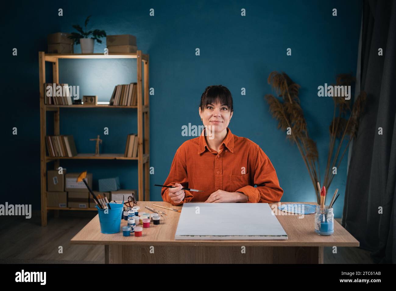 Painting at home. Happy woman ready drawing canvas picture at home ...