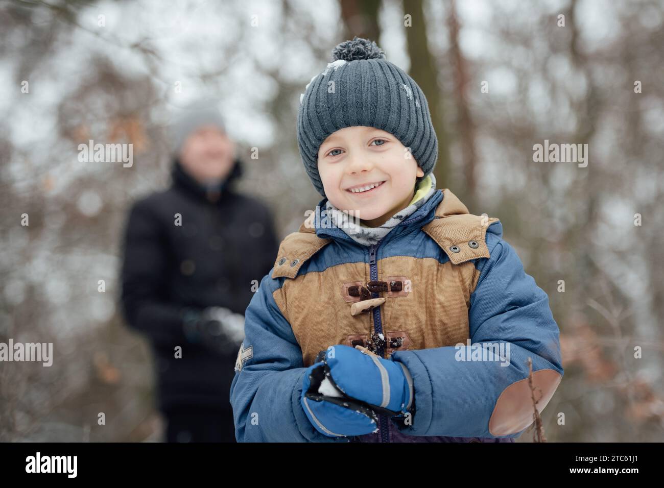 Six year old boy smiling during makeing snowball Stock Photo - Alamy