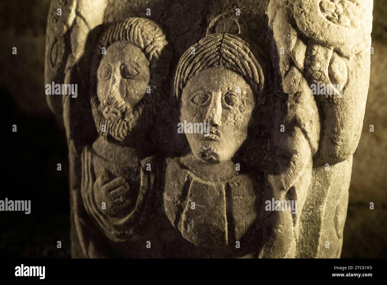 There are some grave headings and artifacts exhibited on the lower ...