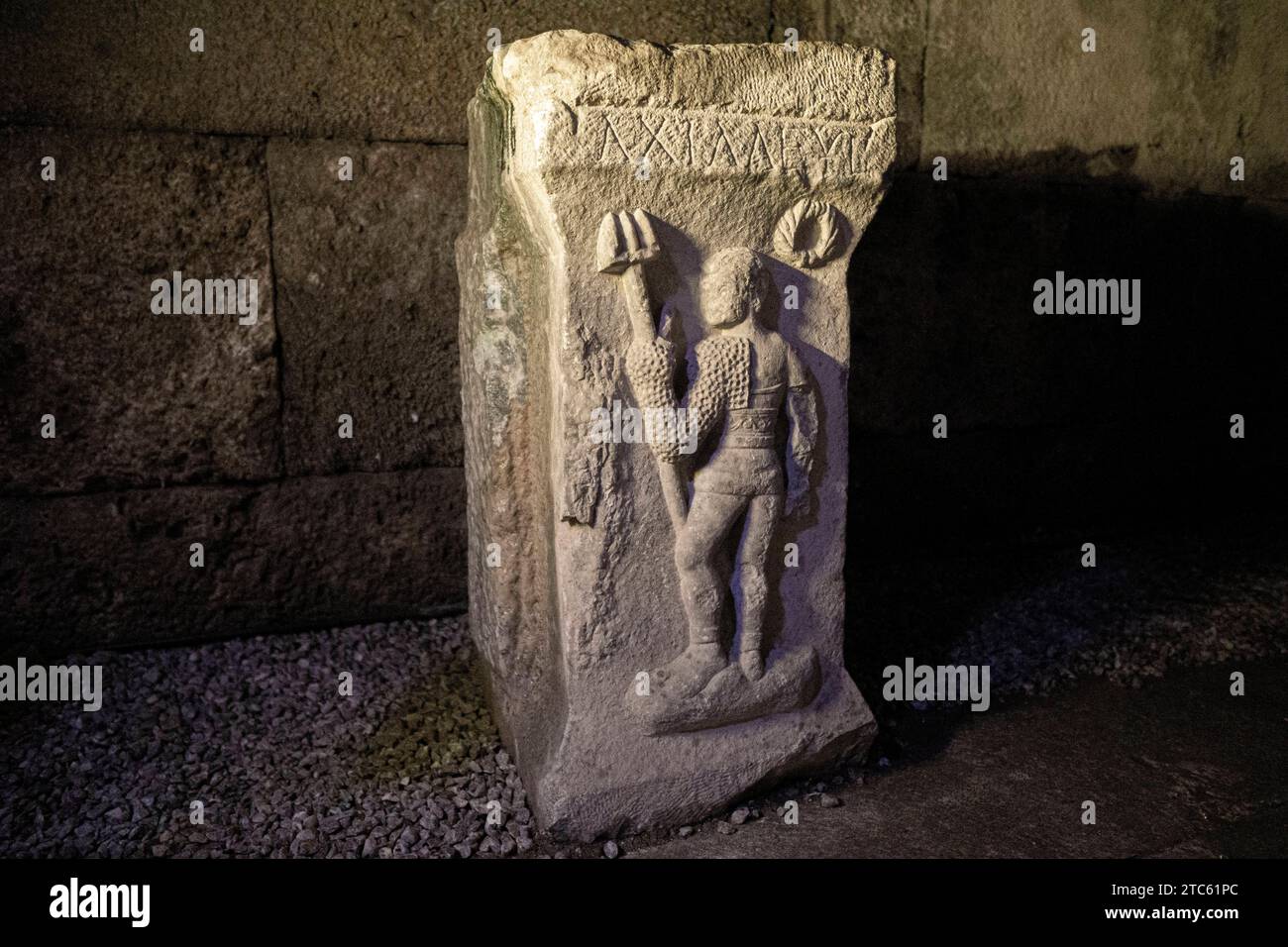 There are some grave headings and artifacts exhibited on the lower ...