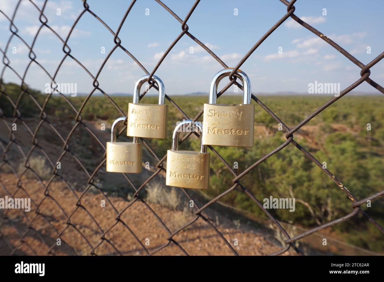 Group of Love locks or padlocks on fence at Lake Moondarra Dam, Mt Isa ...
