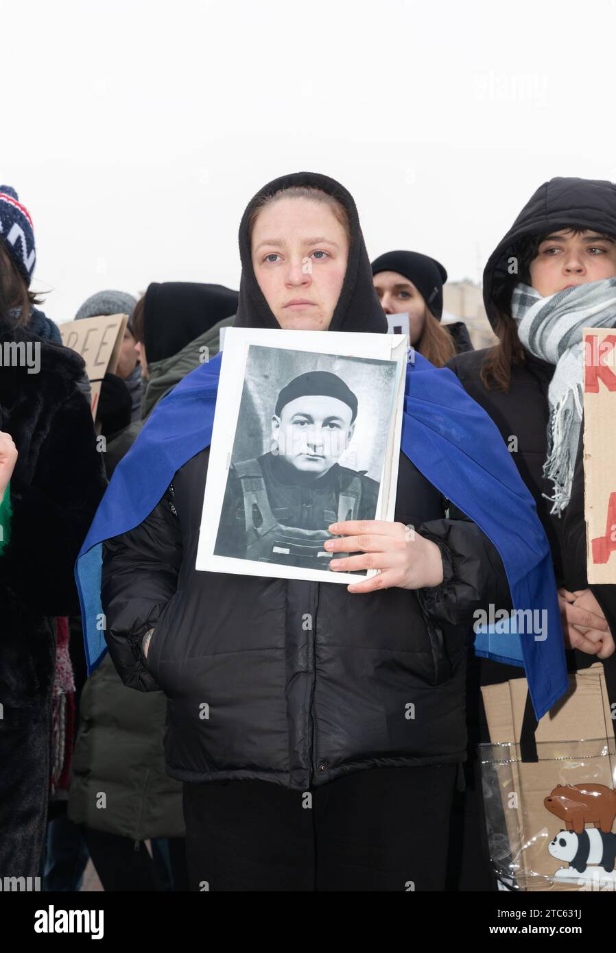 A woman is seen holding a portrait of her close Ukrainian defender Azov ...