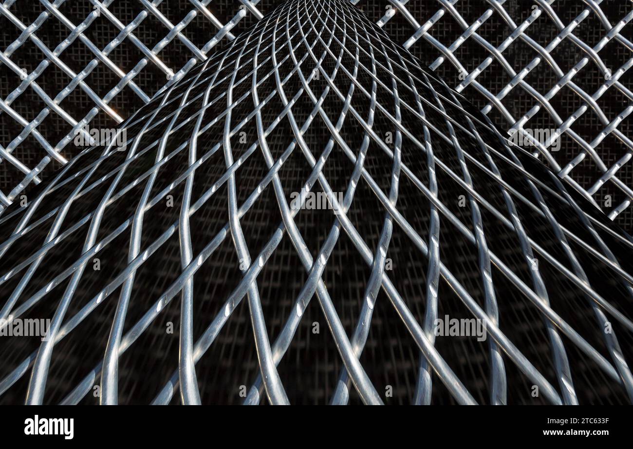 metal mesh or aluminum grid with regular pattern on black background ...