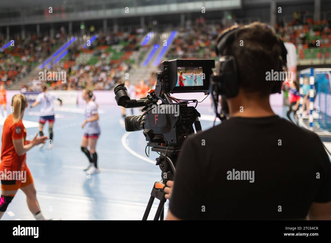 TV camera and cameraman during handball match Stock Photo - Alamy