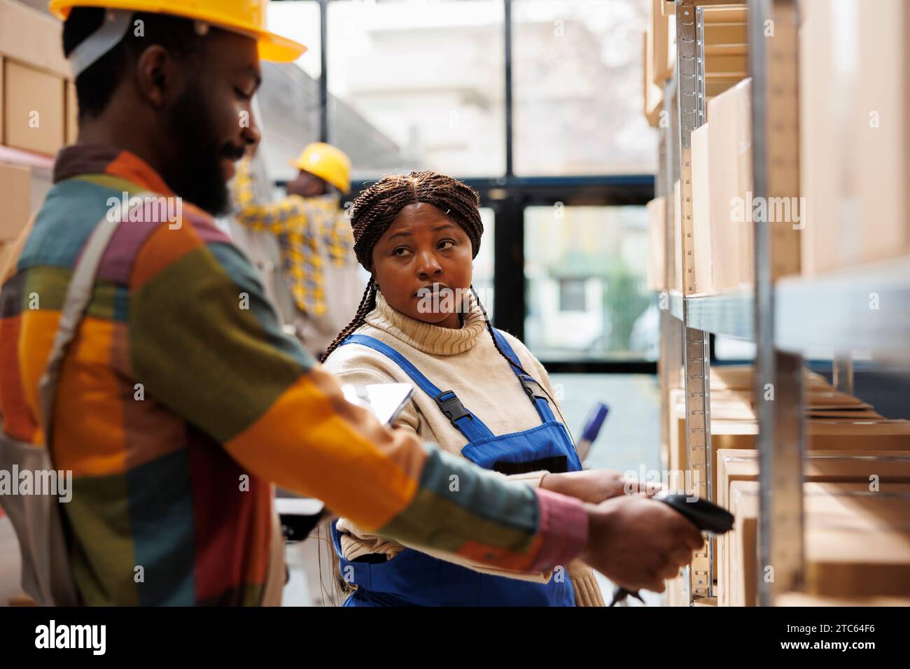 Woman checking packages barcode scanner hi-res stock photography and ...