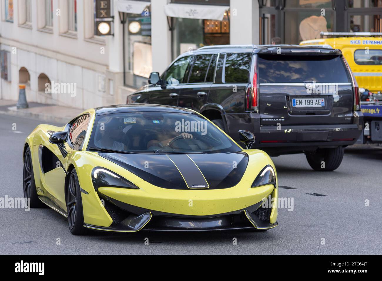 Monaco, Monaco - Yellow McLaren 570GT driving on the road in the ...