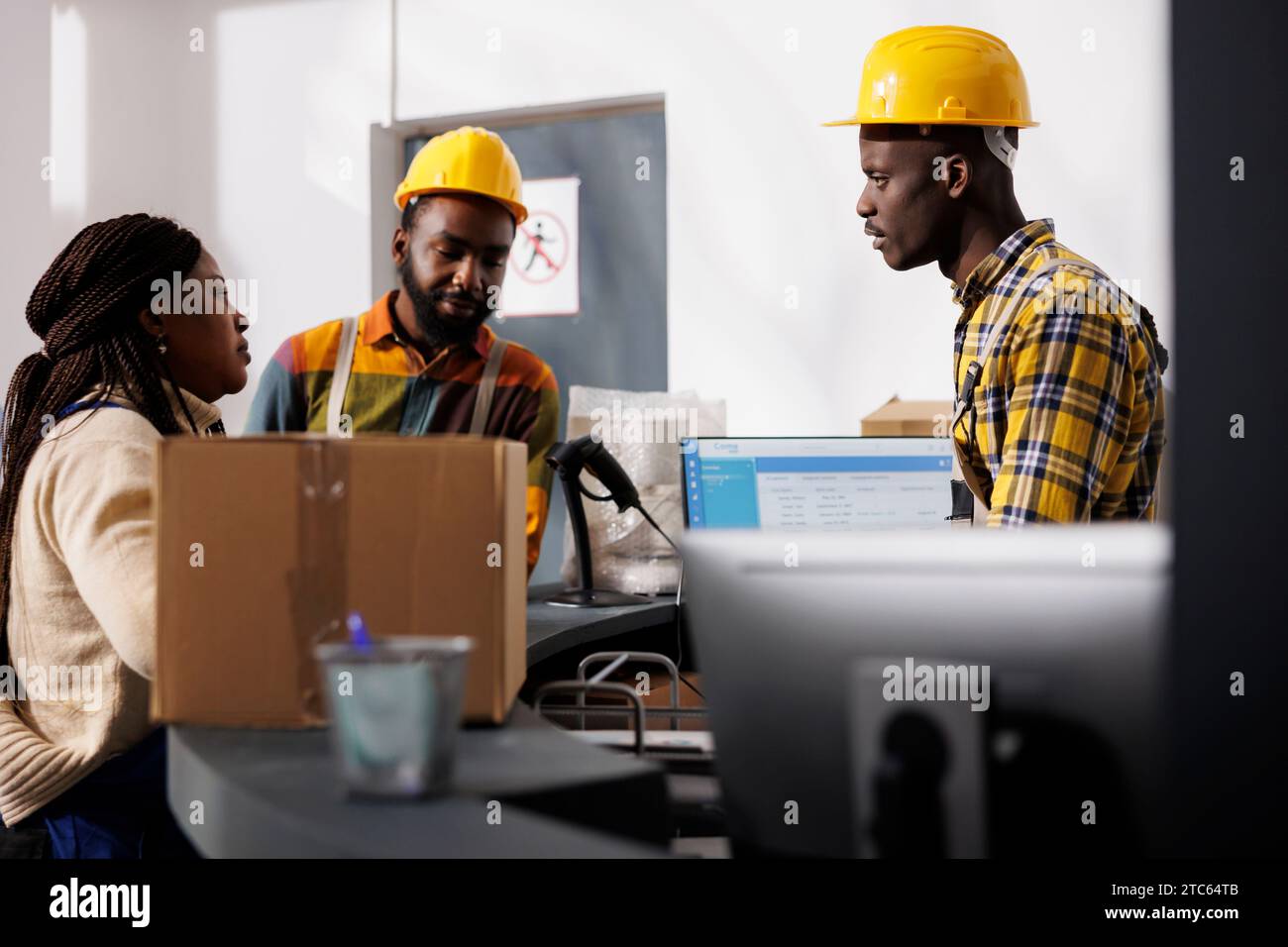 African american delivery service workers team discussing merchandise ...