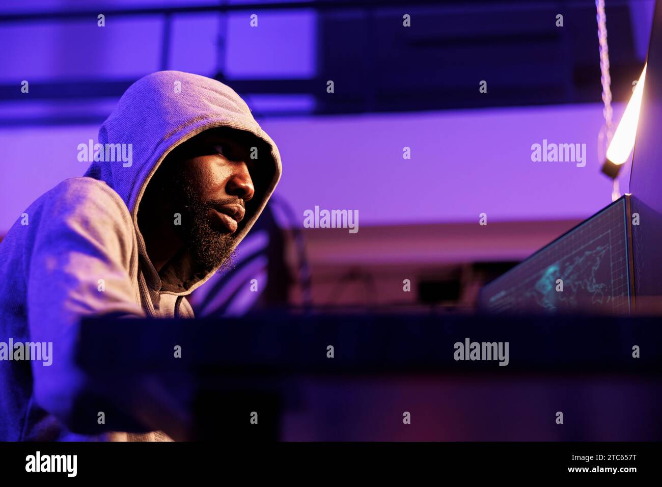 African american internet thief planning phishing attack and online ...