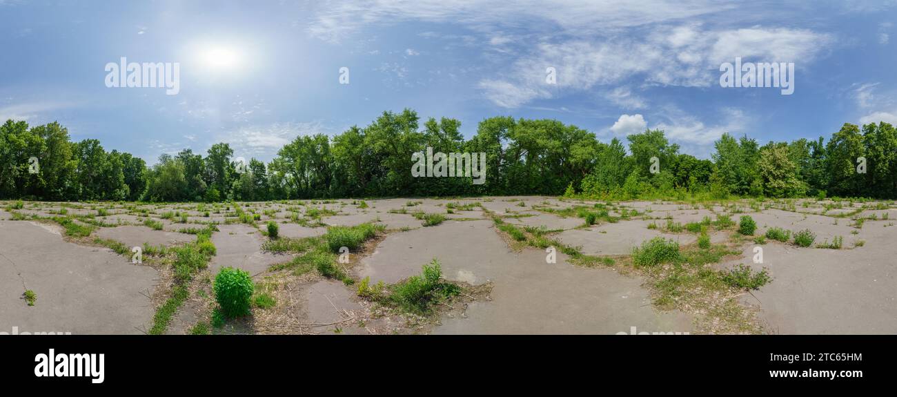 Panorama of abandoned park with an overgrown asphalt playground Stock ...