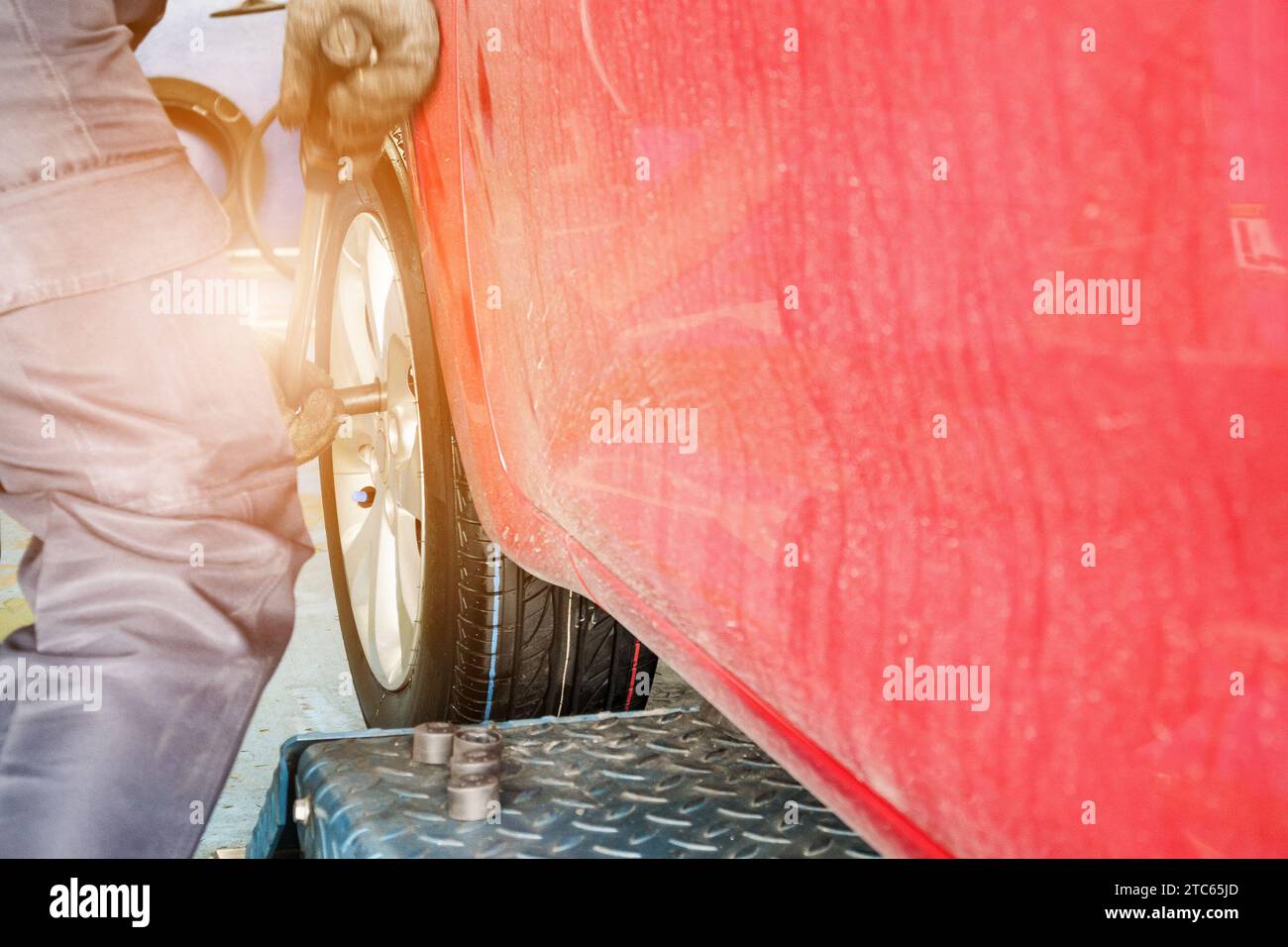 Tire replacement service, Mechanic with wrench working at auto repair ...