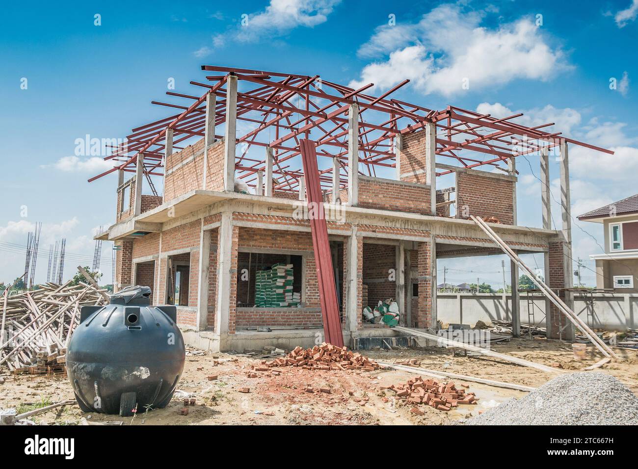 house building structure at construction site with clouds and blue sky ...