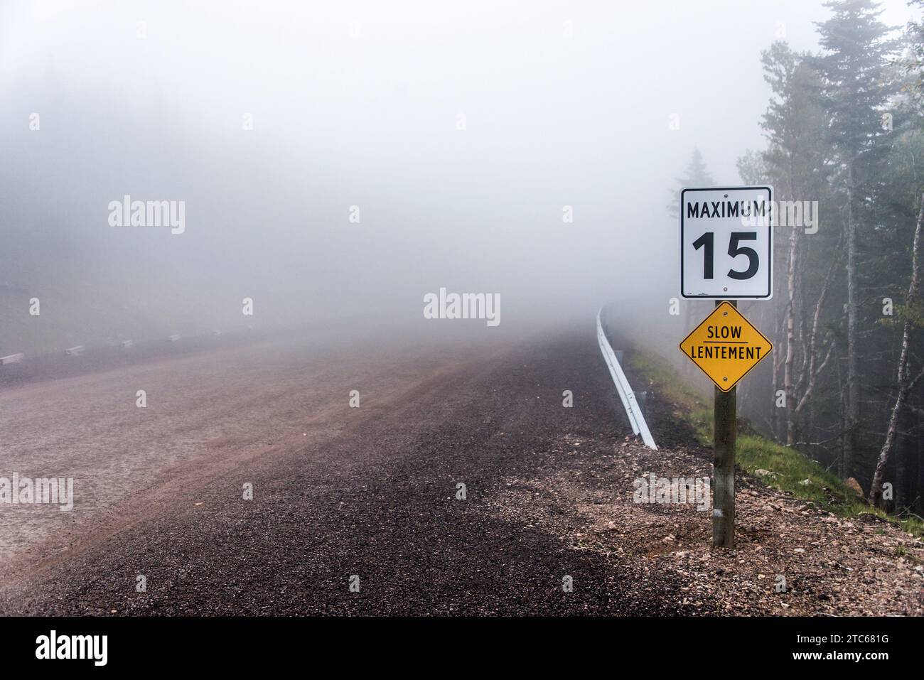 Slow Lentement sign Warning yellow roads signs in selective focus view ...