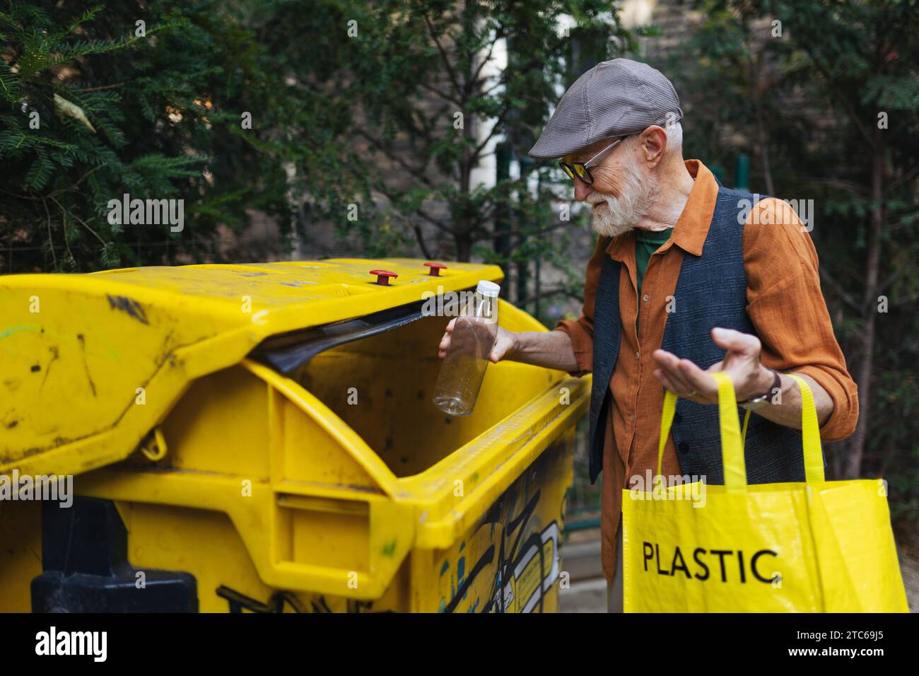 Elderly man throwing plastic bag hi-res stock photography and images ...