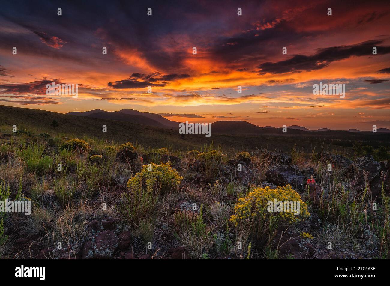 A stunning landscape featuring a majestic mountain range at sunset ...