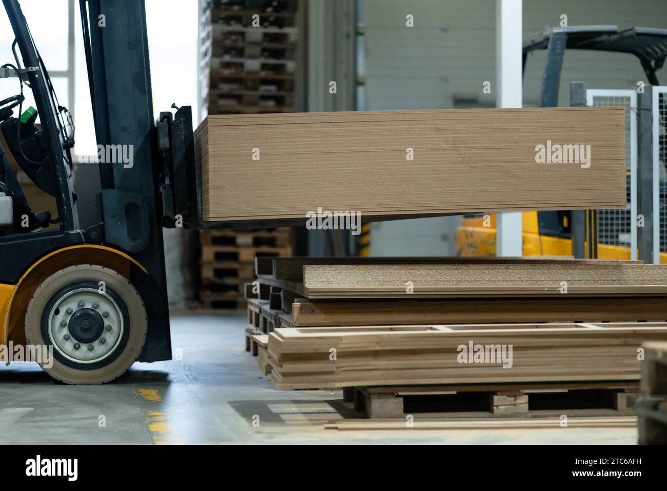Close up of forklift working in warehouse. Industrial lift truck ...