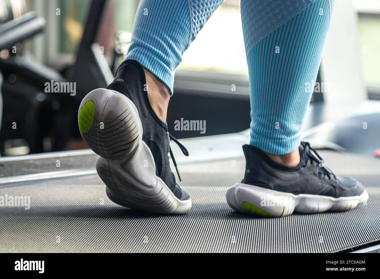 Woman's legs on a treadmill, shoes close-up, cardio workout Stock Photo ...