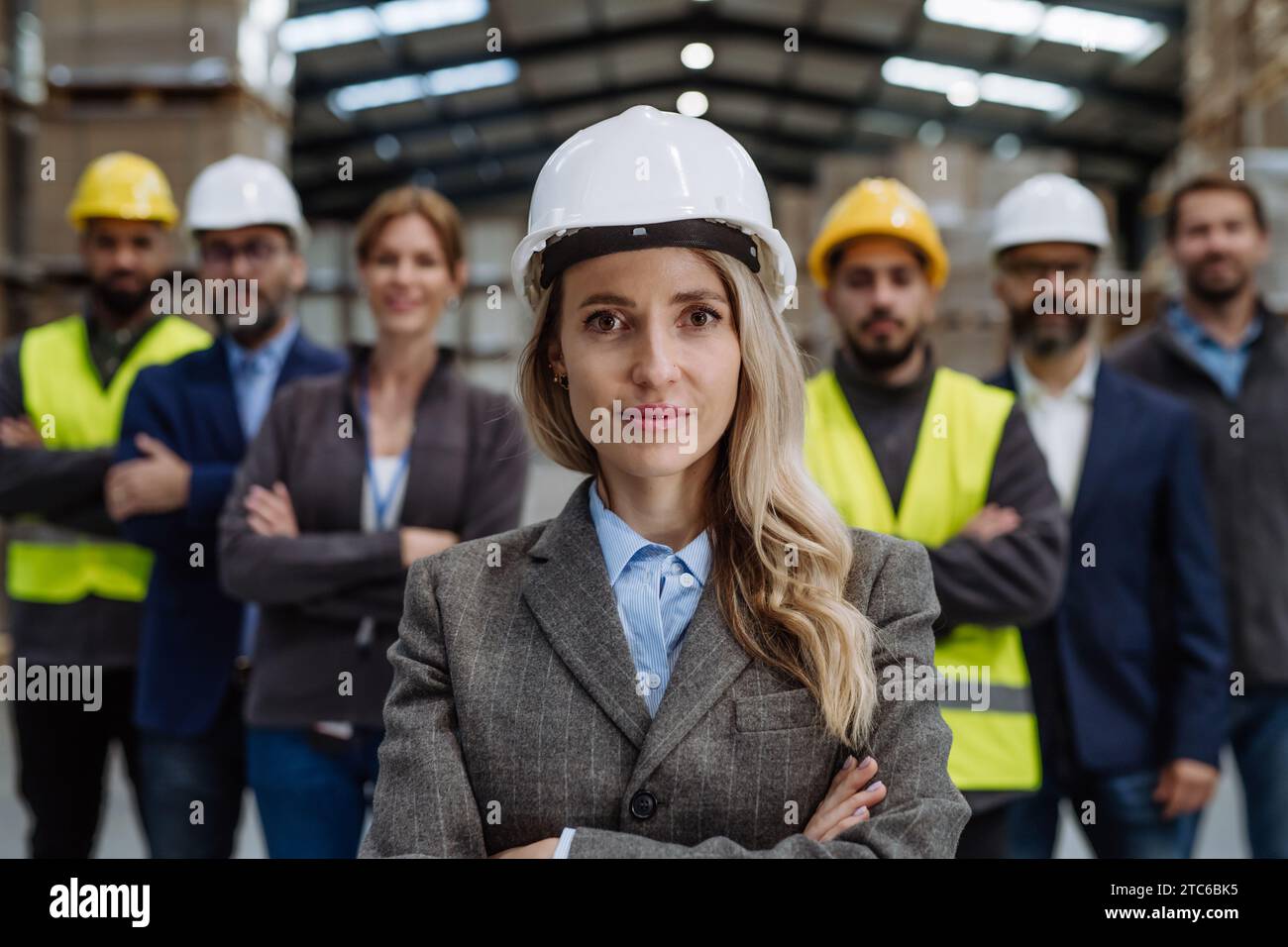 Full team of warehouse employees standing in warehouse. Team of workers ...