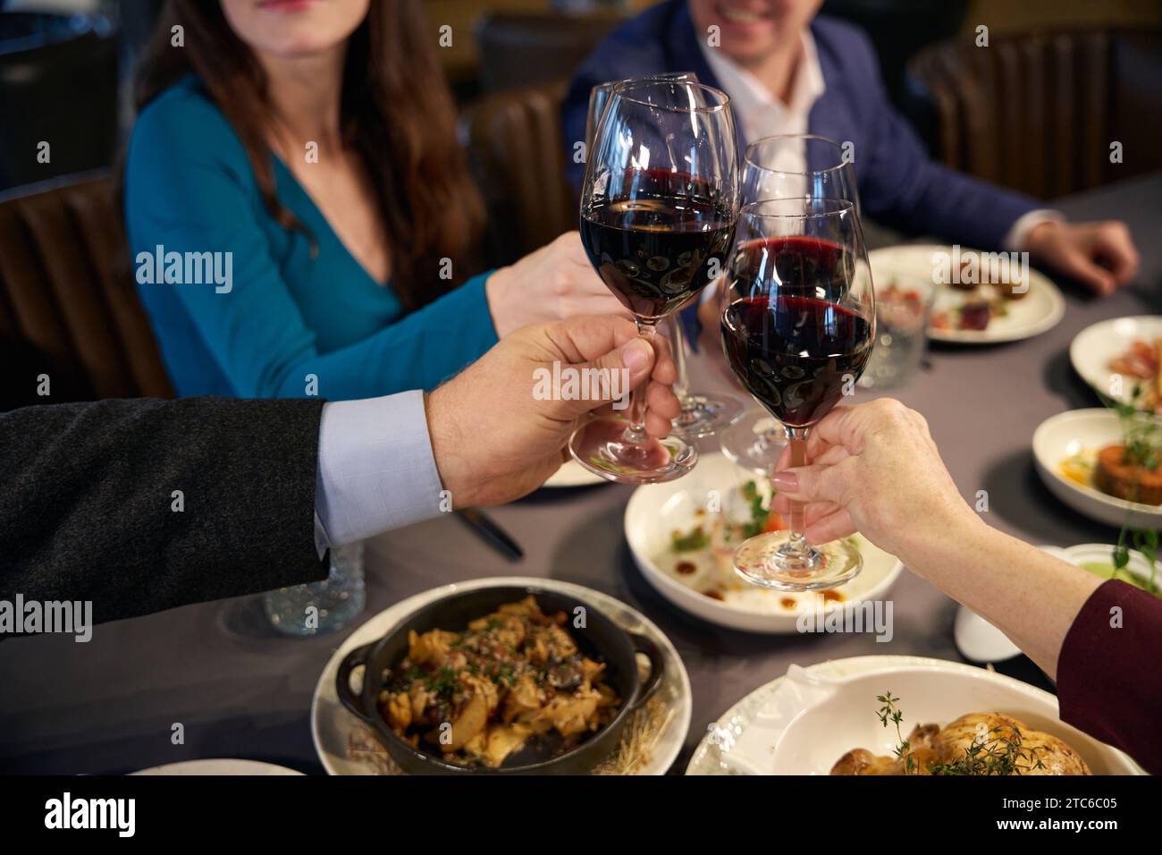 Family clinking glasses festive table hi-res stock photography and ...
