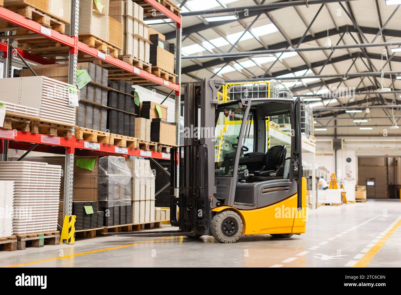 Close up of forklift working in warehouse. Industrial lift truck ...