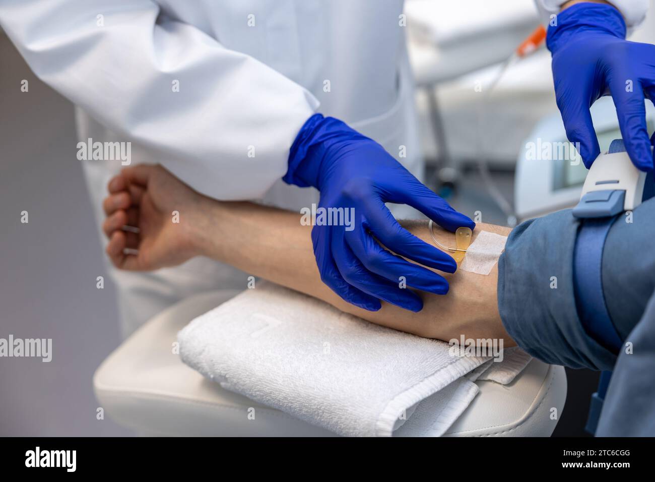 Patient man receiving infusion drip in hospital or beauty salon Stock ...