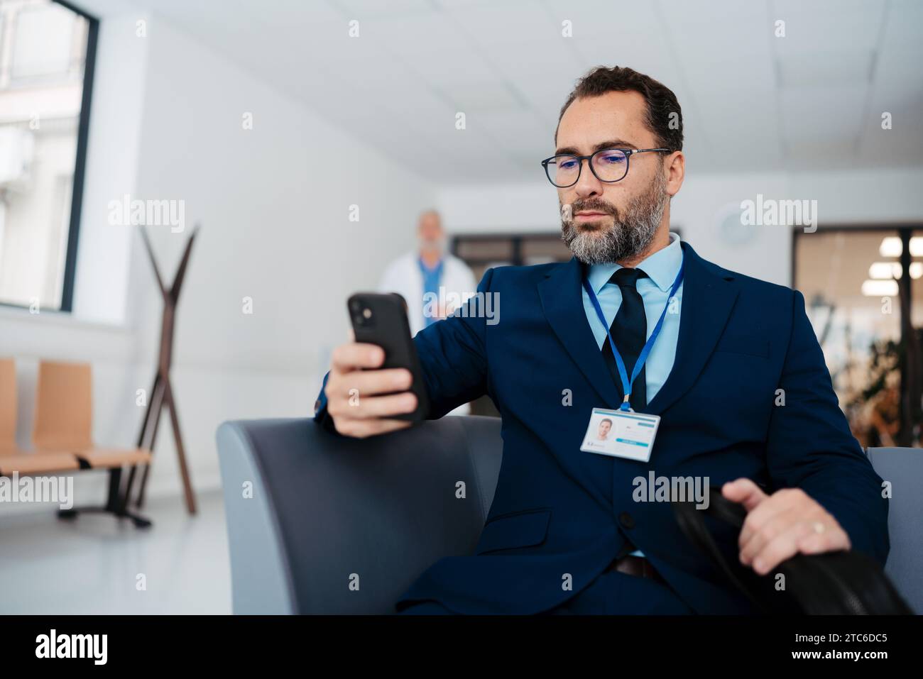 Pharmaceutical sales representative sitting in medical building ...