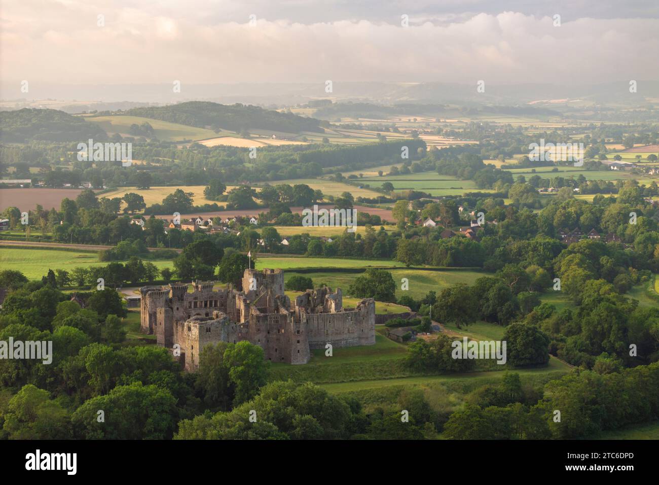 Aerial view of the ruins of Raglan Castle on a misty morning ...