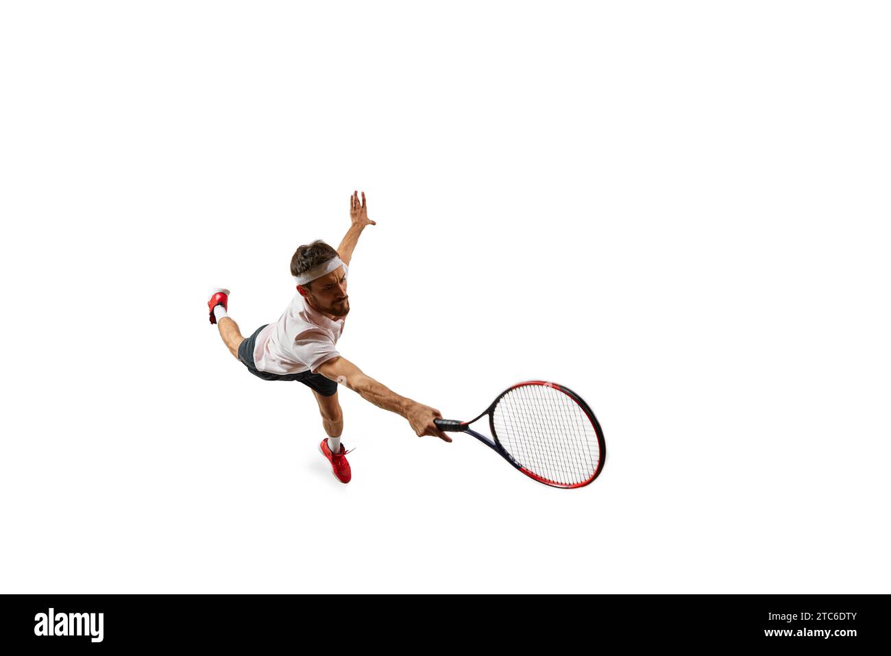 Top view. Concentrated and competitive young man practicing tennis, in ...