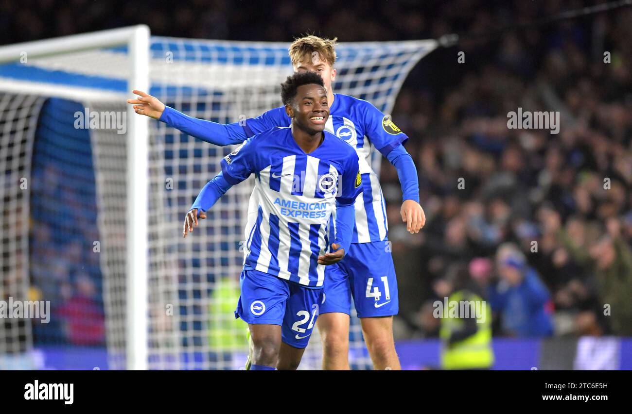 Simon Adingra of Brighton celebrates scoring their equaliser in the ...