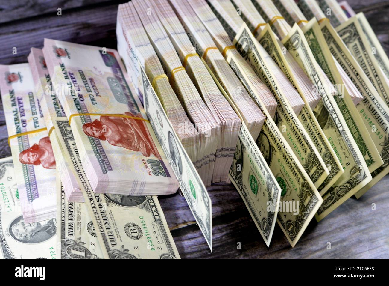 Two piles of cash bills hi-res stock photography and images - Alamy