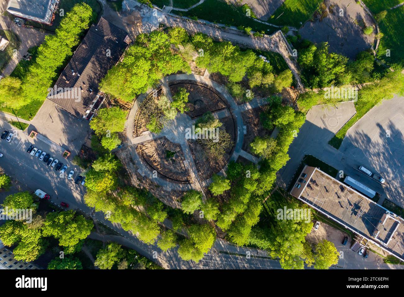 Aerial view of the reconstruction of a circular city square with paths ...