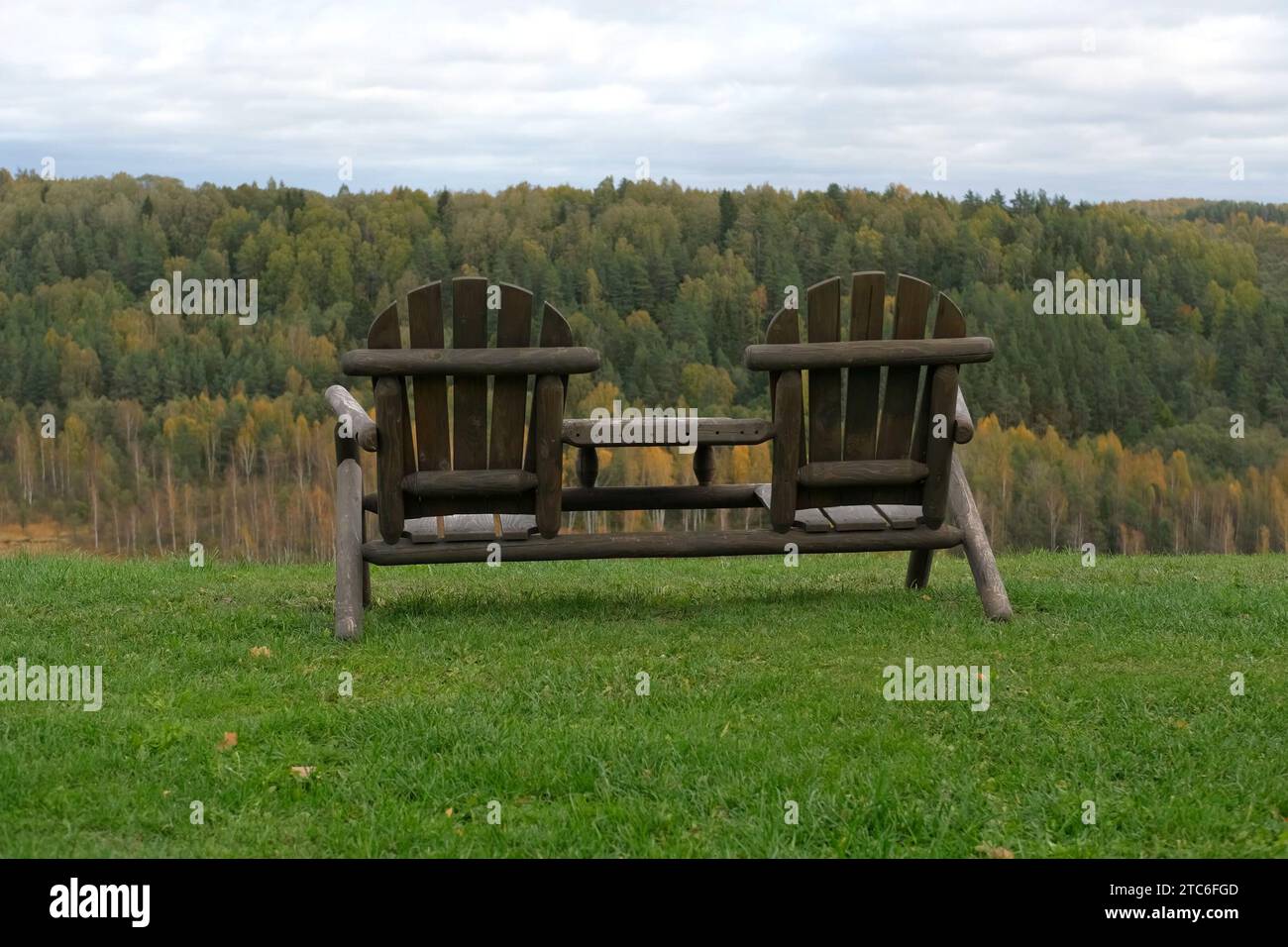 Wooden chairs on cabin terrace with mountain view. Chilled Weekend ...