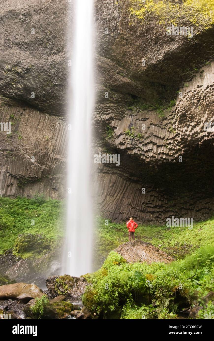 A woman admires Latourel Falls on June 27, 2007 near Corbett, Oregon ...