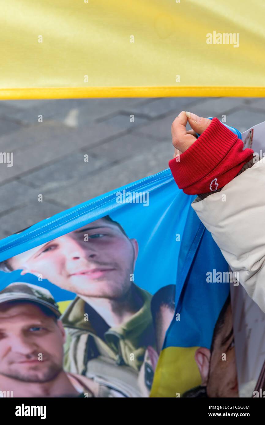 A portrait of a prisoner of war hero is seen printed on the flag of ...
