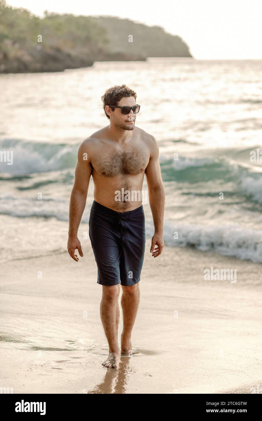 Thoughtful man in shorts hi-res stock photography and images - Alamy