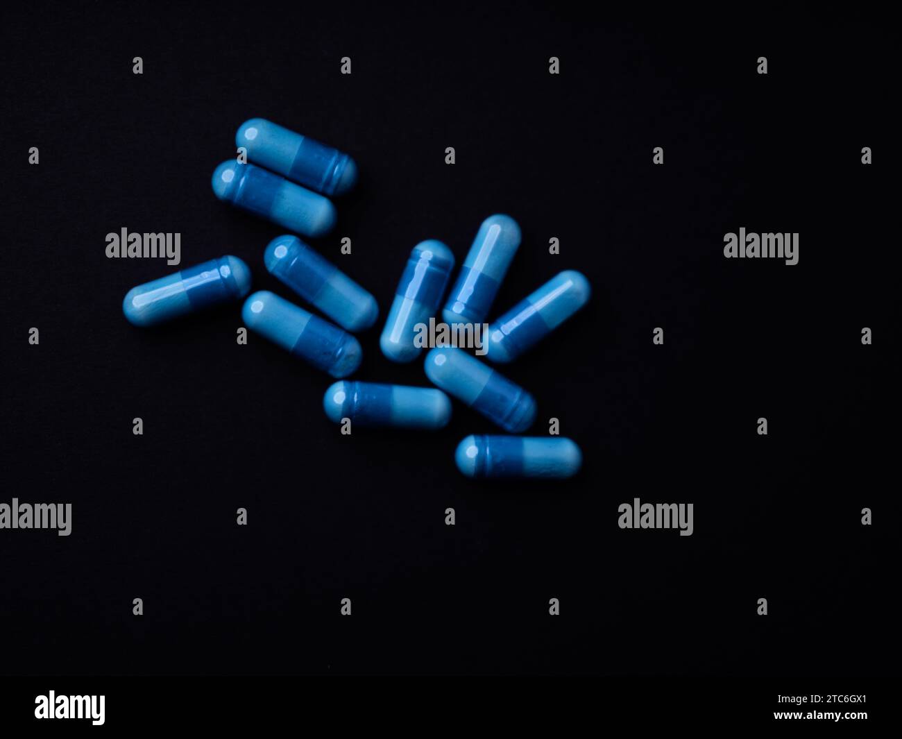 Amino acids capsules on dark paper background. Soft focus Stock Photo ...