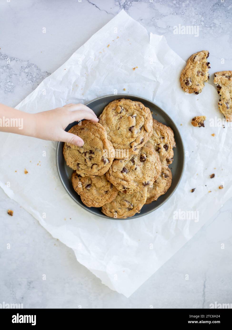 childrens hands reaching for homemade chocolate chip cookies on Stock ...